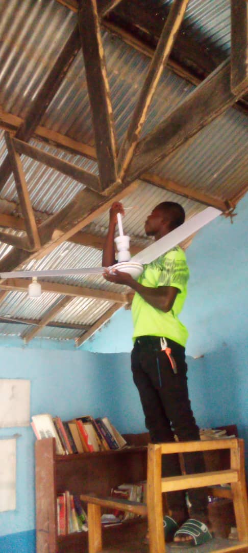 Repairing ceiling fan in Sherigu library, Ghana – Friends of African ...